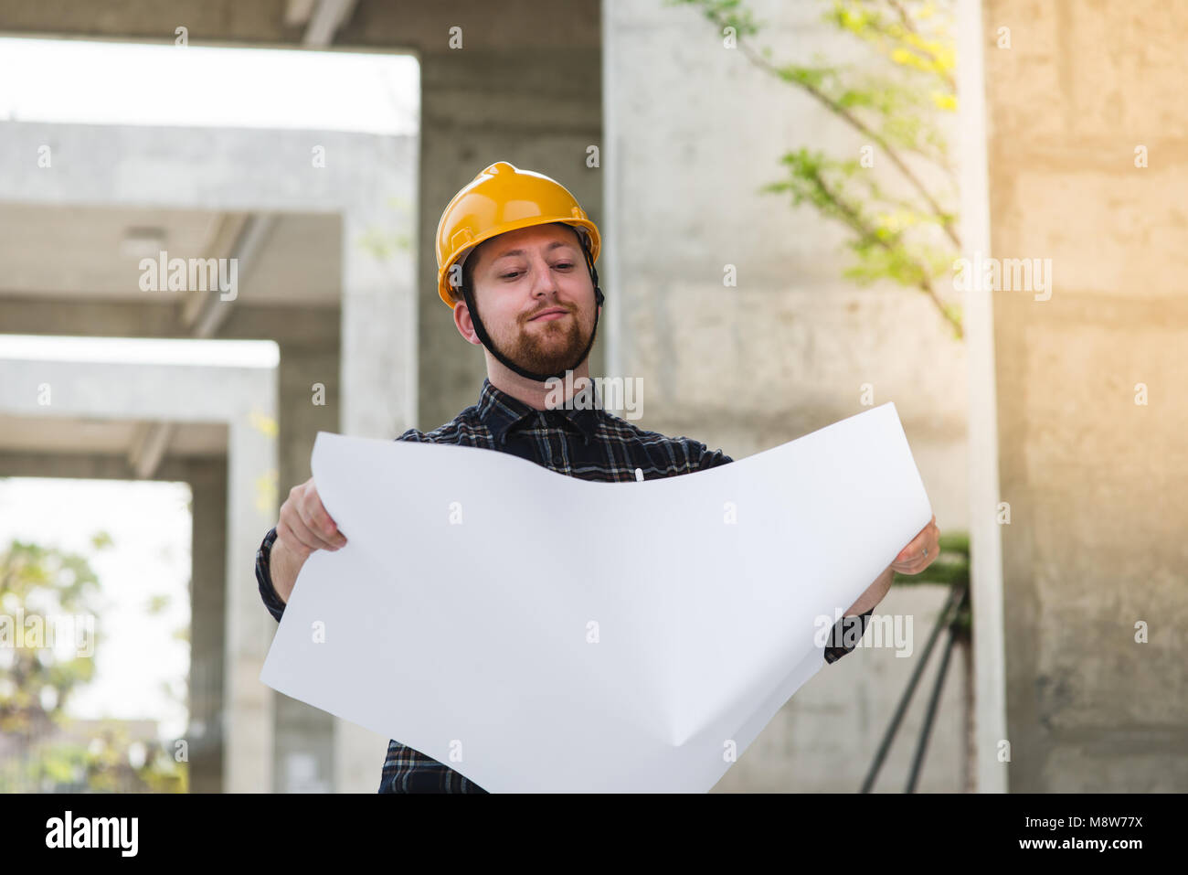 Engineer holding blueprint hi-res stock photography and images - Alamy