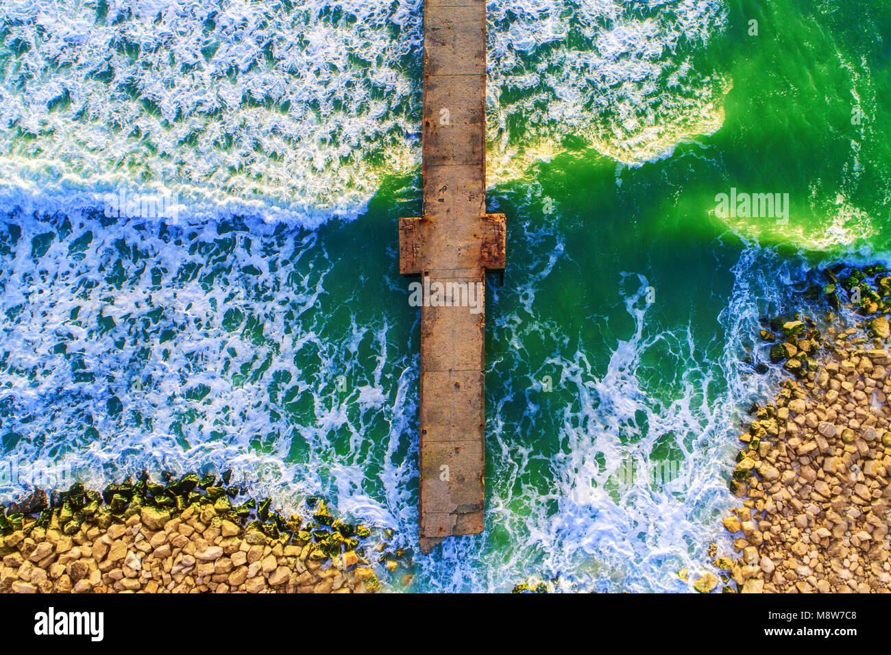 Aerial view over the old broken bridge in the sea, sunrise shot Stock ...