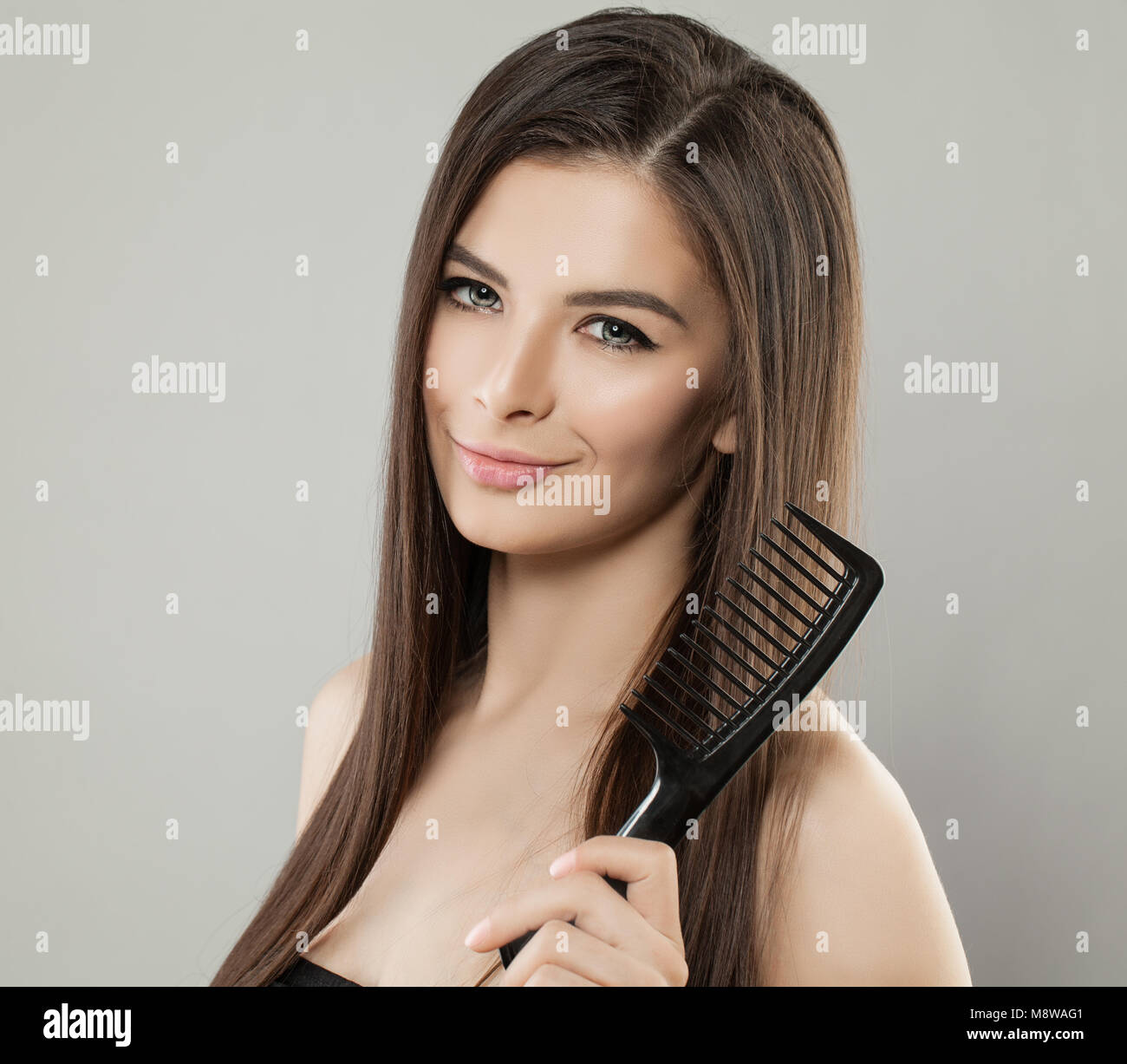 Young Perfect Woman with Healthy Hair and Comb Stock Photo - Alamy