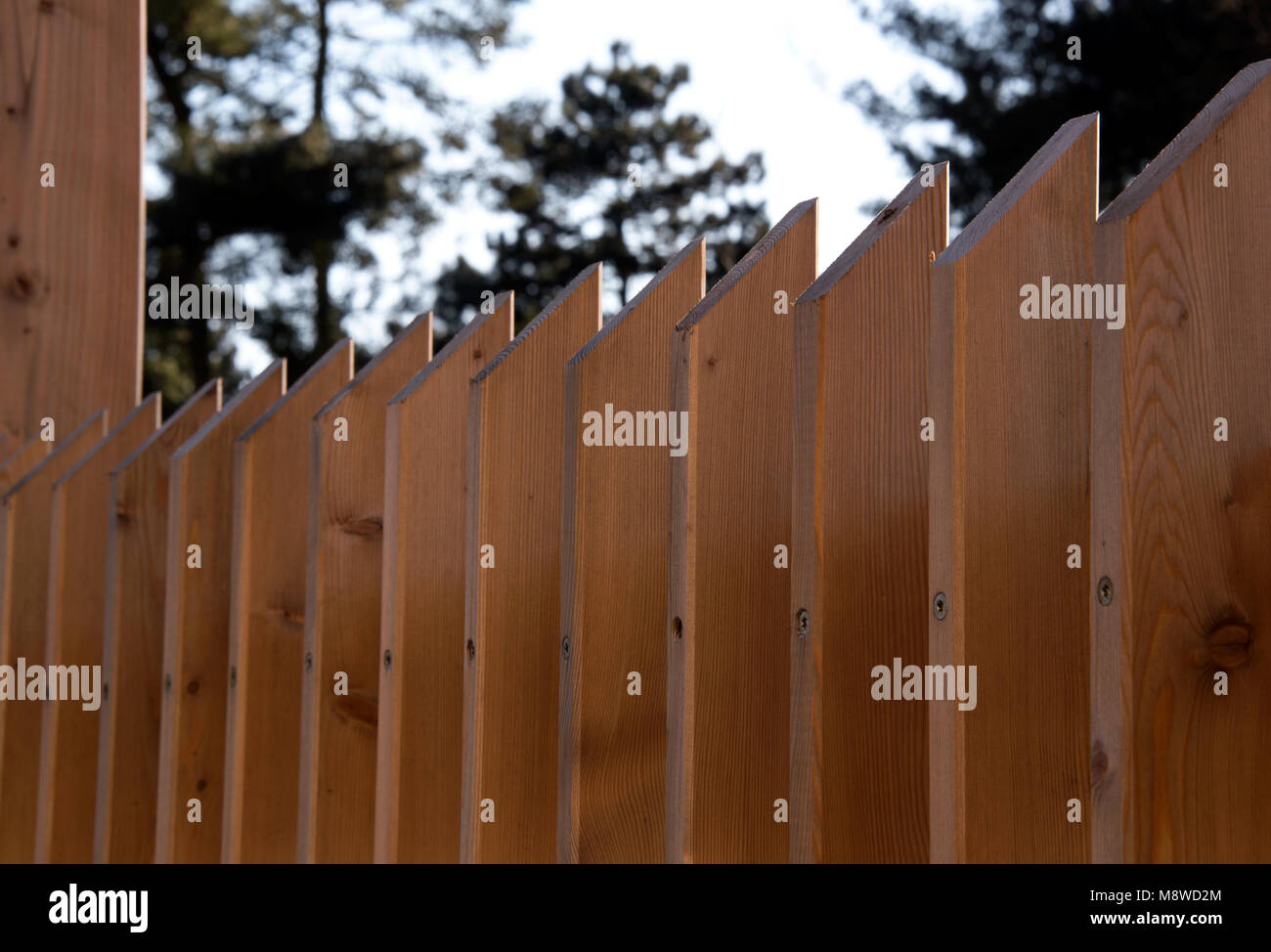 View along a stylish modern timber fence/ privacy screen, with angle ...