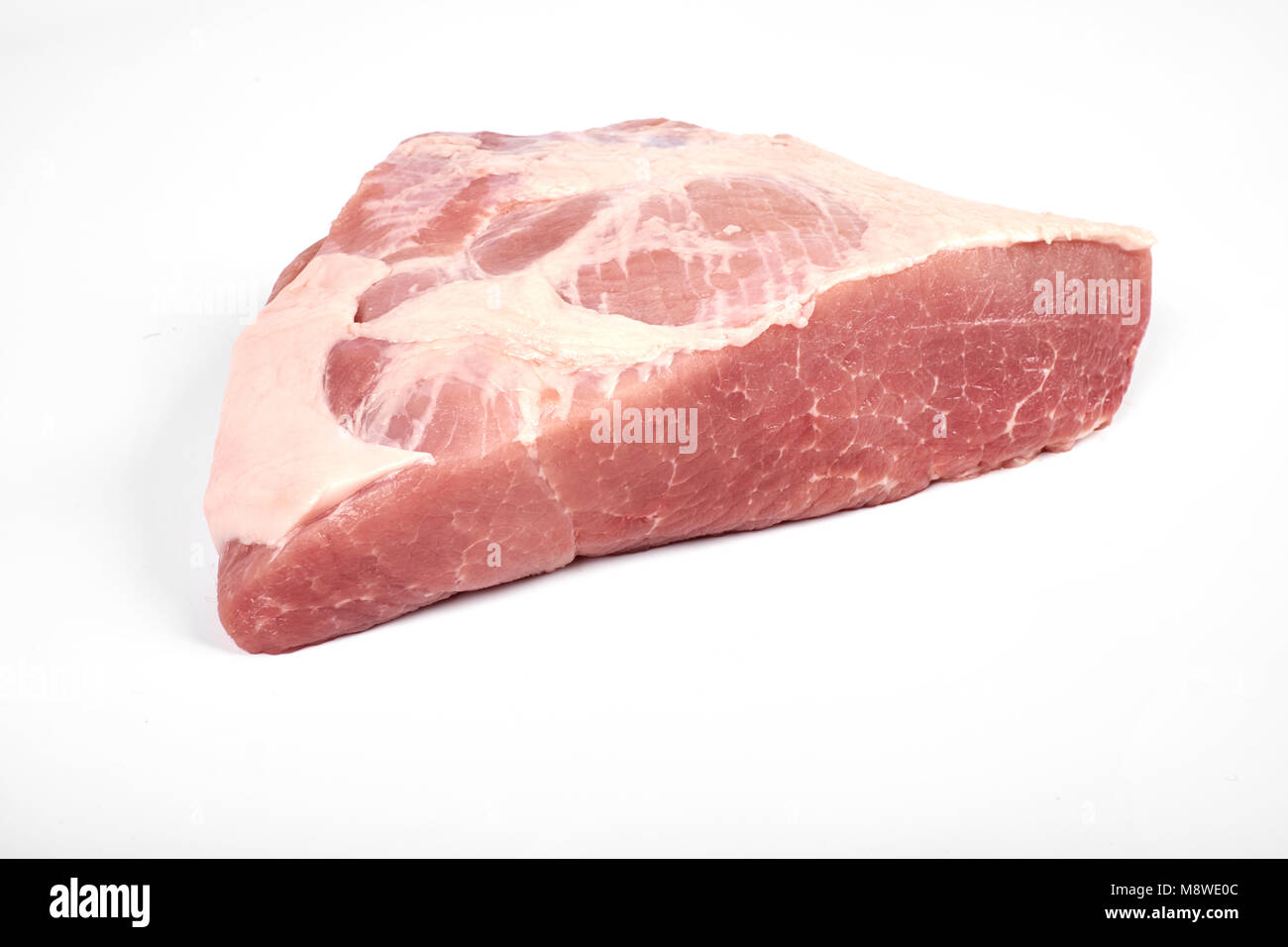 A large piece of pork isolated on white Stock Photo - Alamy