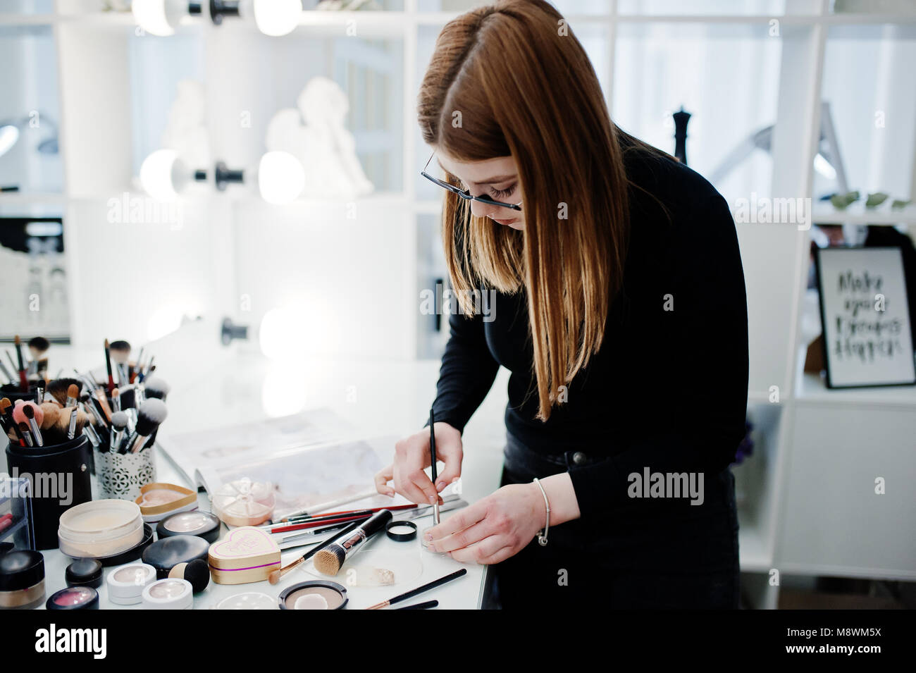 Make up artist work in her beauty visage studio salon. Woman ...