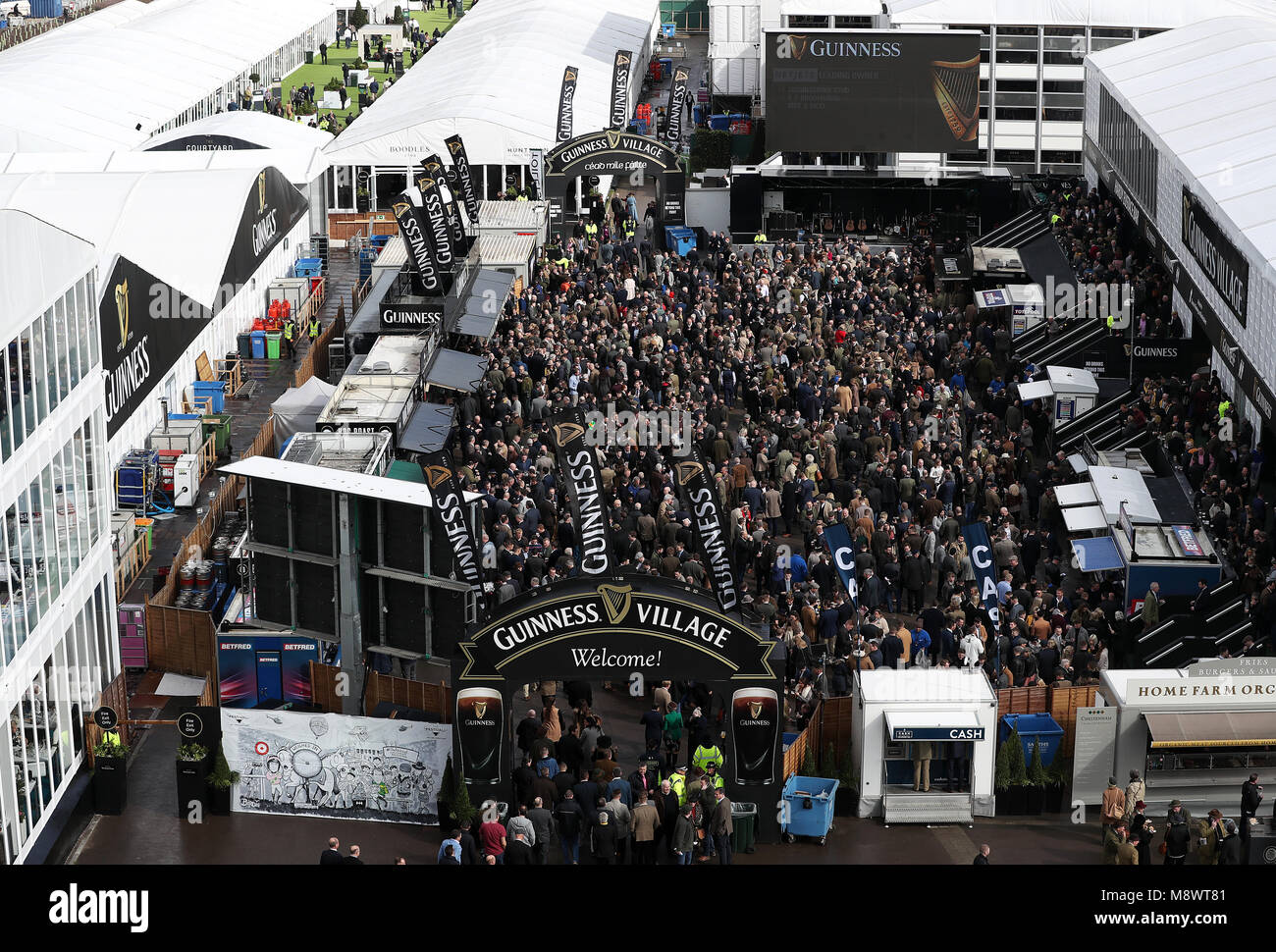 Racegoers in the Guinness Village during St Patrick's Thursday of the ...