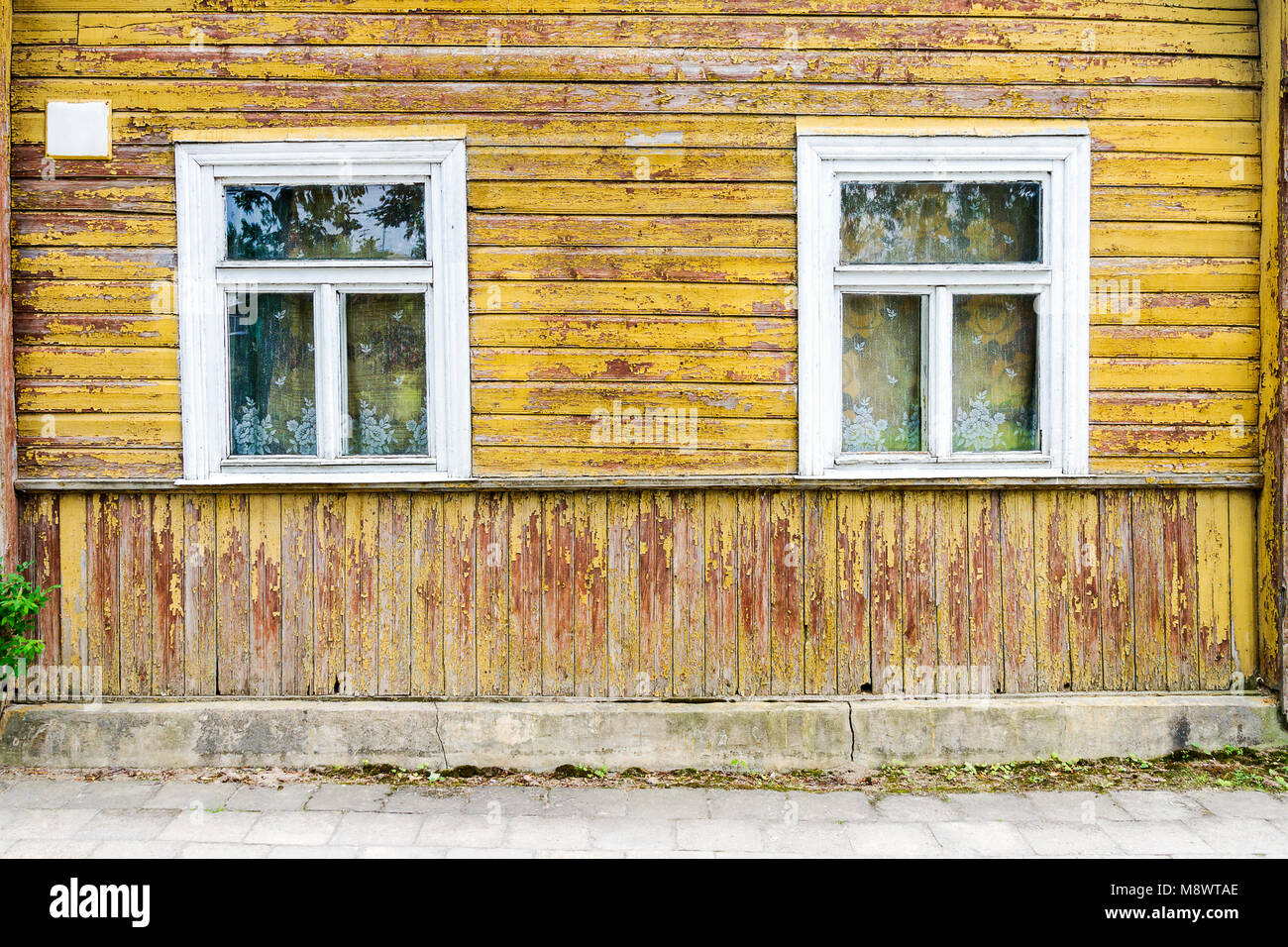Old windows on a aged wooden wall. Architectural detail. Architecture ...