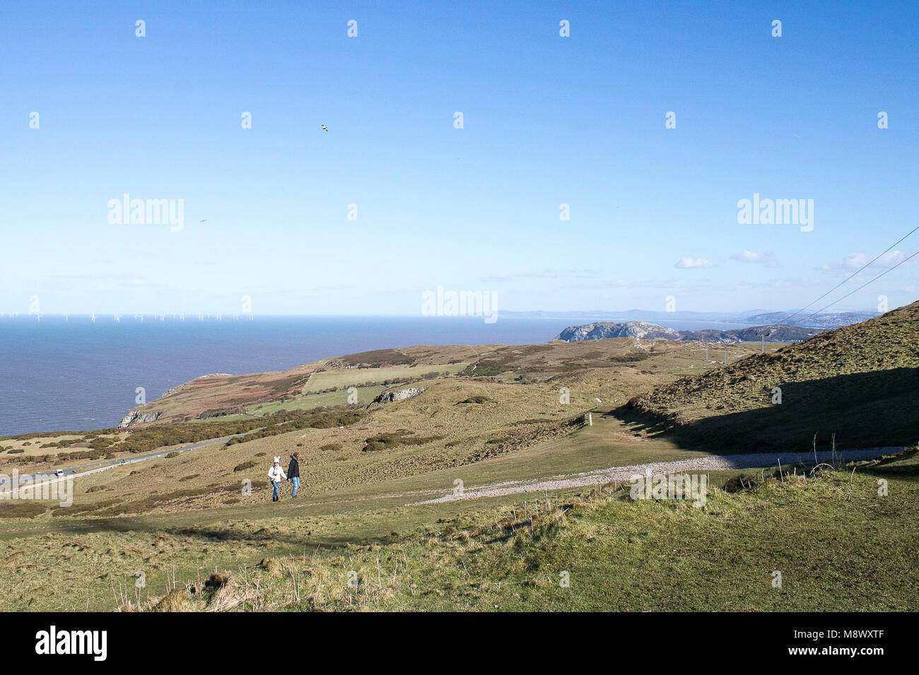 Landscape view of mountains and sea with wind farm at the Great Orme mountain in Llandudno ...