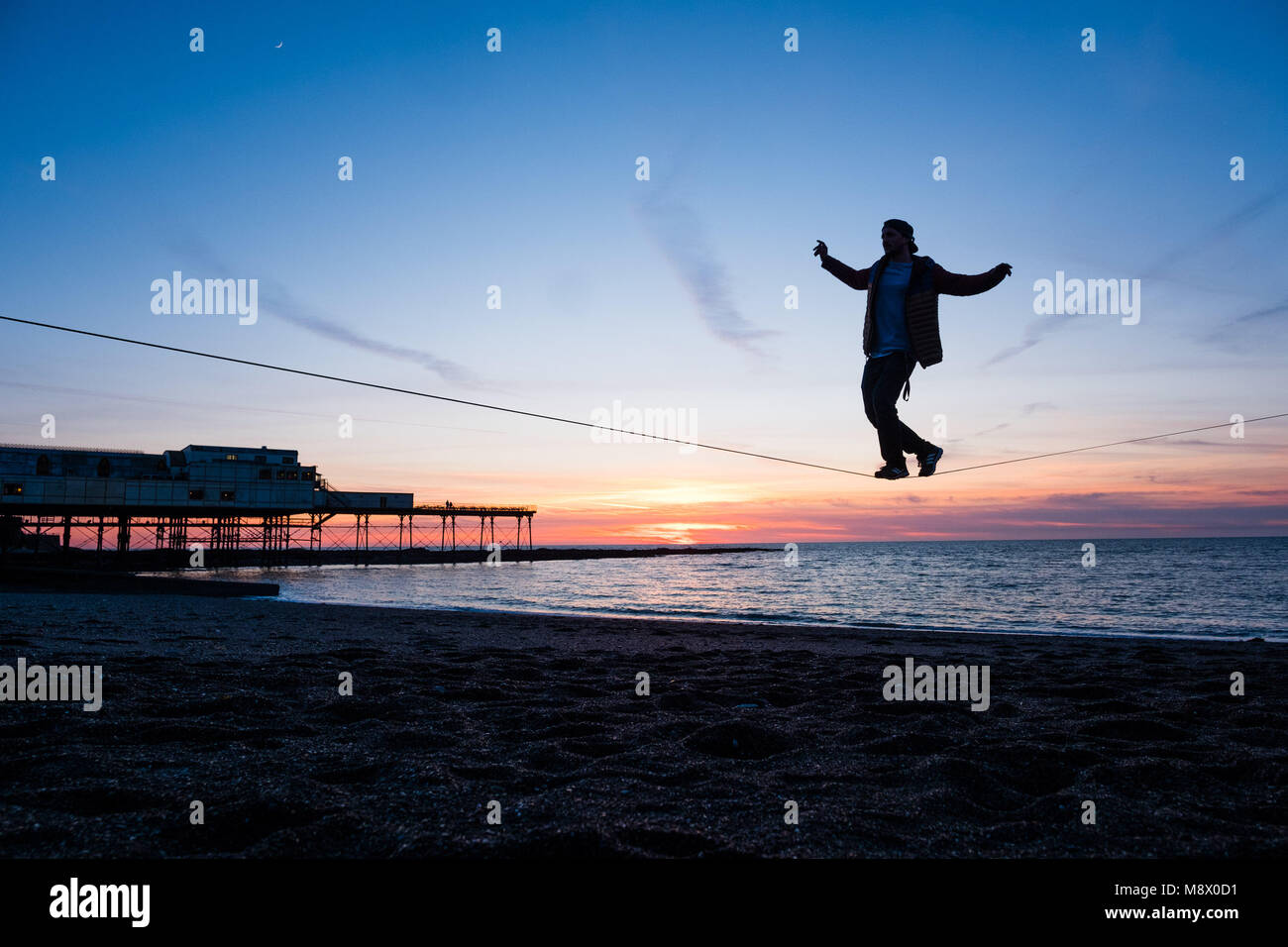 Young man student walking slackline uk hi-res stock photography and ...