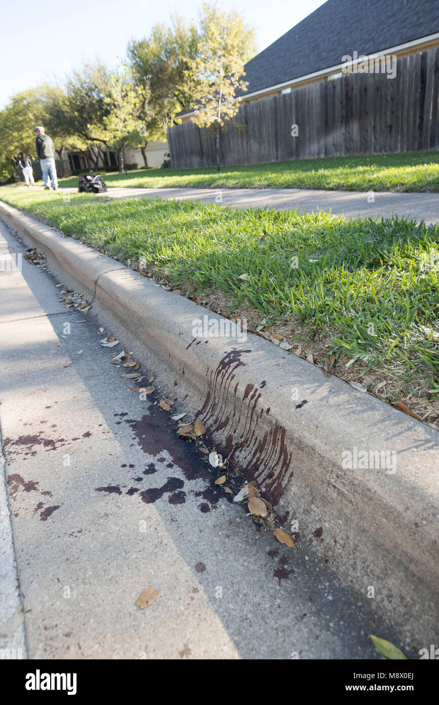 Dried blood stains curb at site of 4th bombing in Austin, TX, that ...