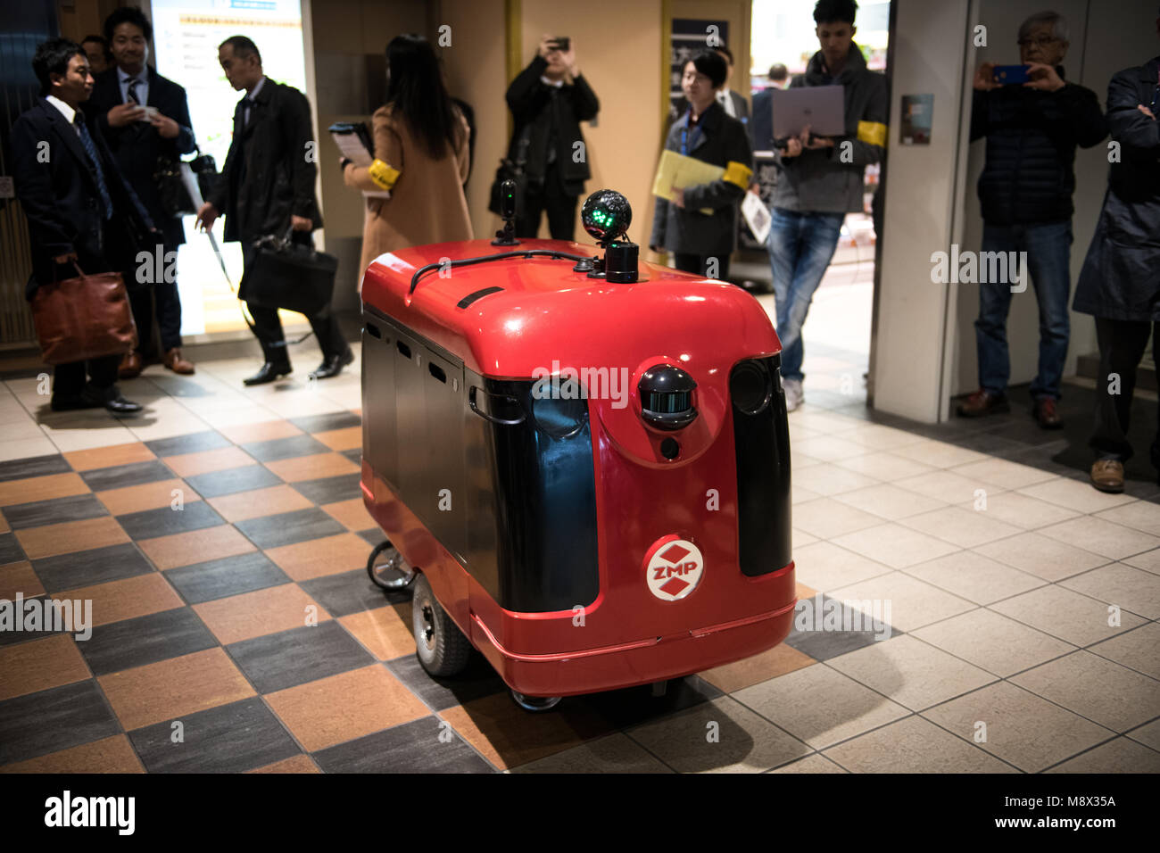 TOKYO, JAPAN - MARCH 20: A prototype of a food delivery robot named ...