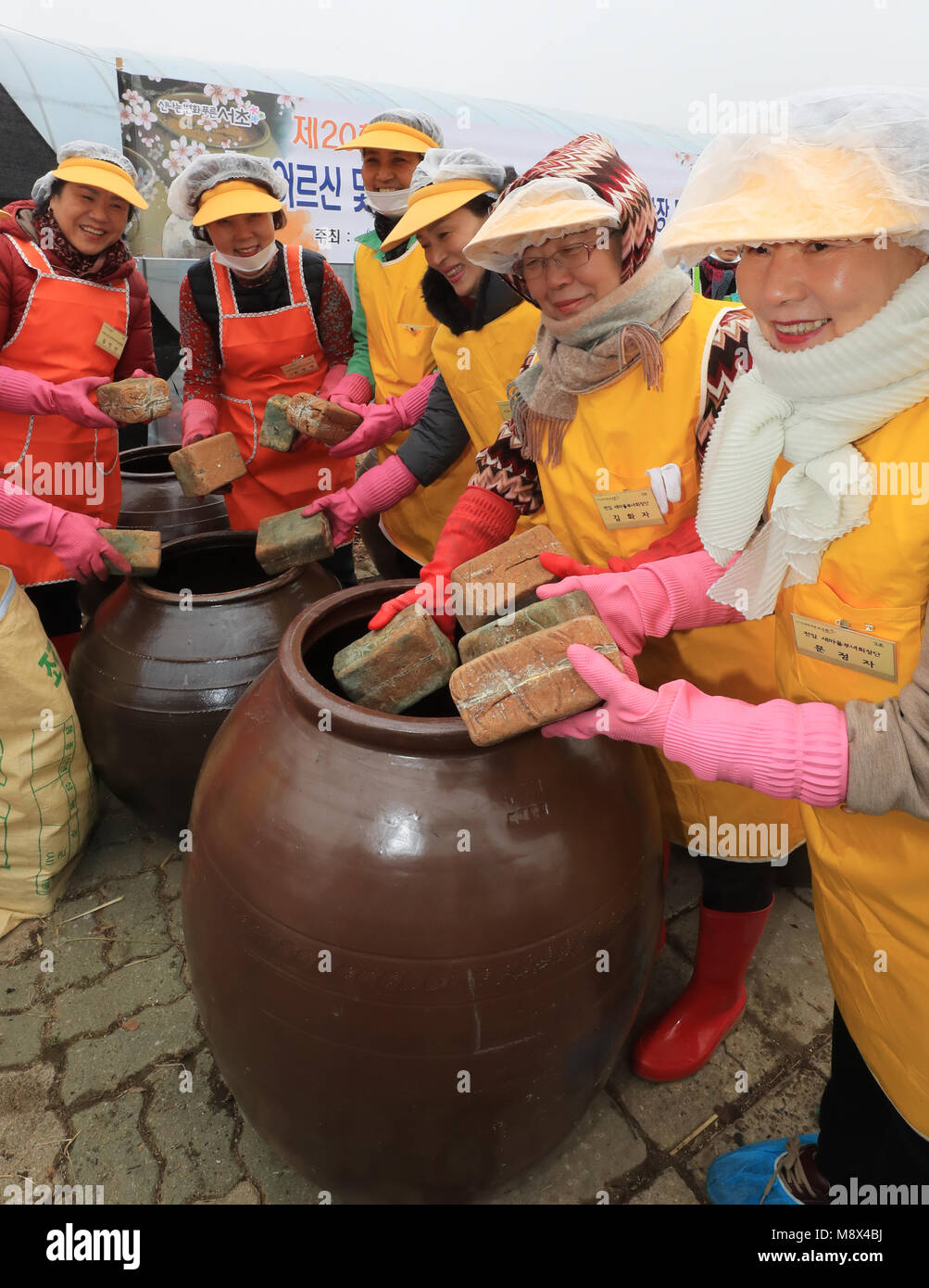 21st Mar, 2018. Making Korean soybean paste Women put dried bricks of ...