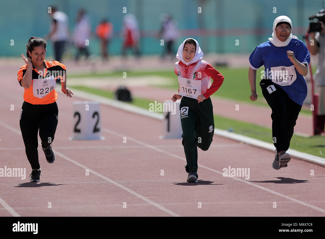 Dubai. 21st Mar, 2018. Athletes run during a 25 meters sprint ...