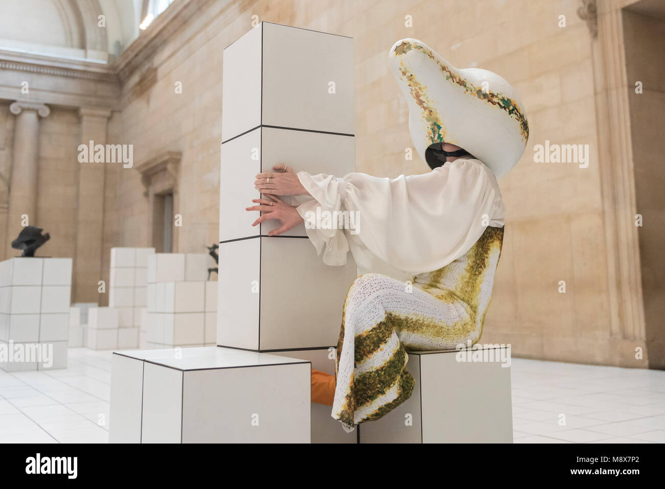 London, UK. 21 March 2018. A performer in a squash-like costume at the ...