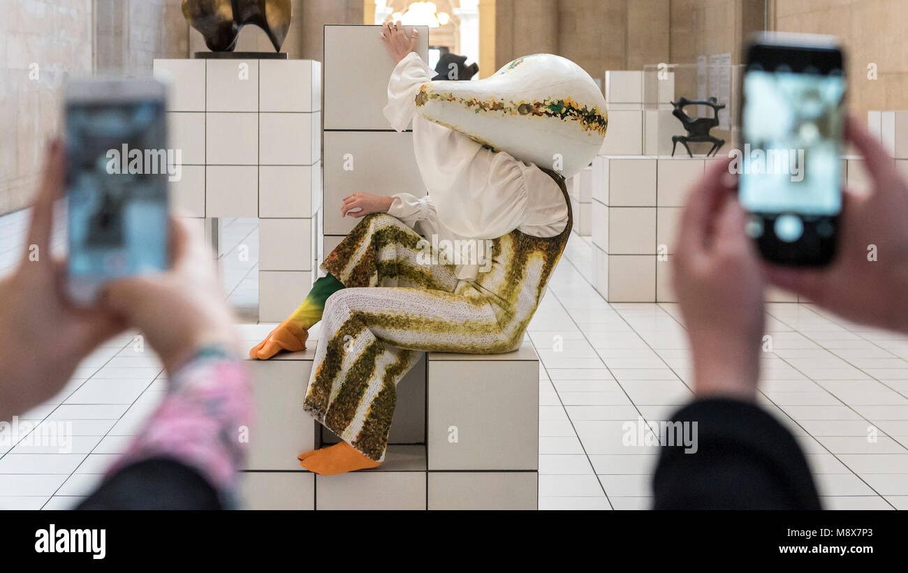 London, UK. 21 March 2018. A performer in a squash-like costume is ...