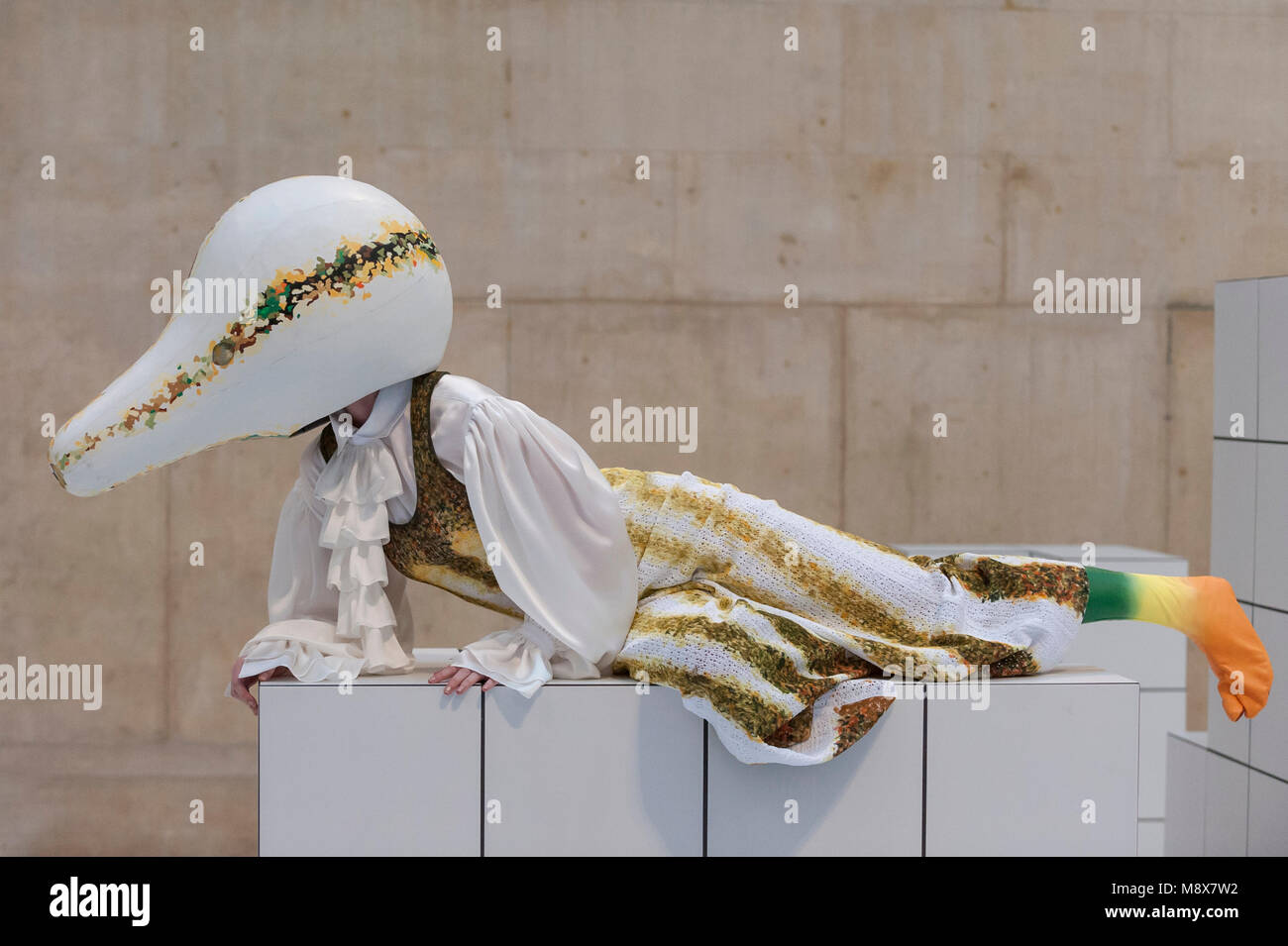 London, UK. 21 March 2018. A performer in a squash-like costume at the ...
