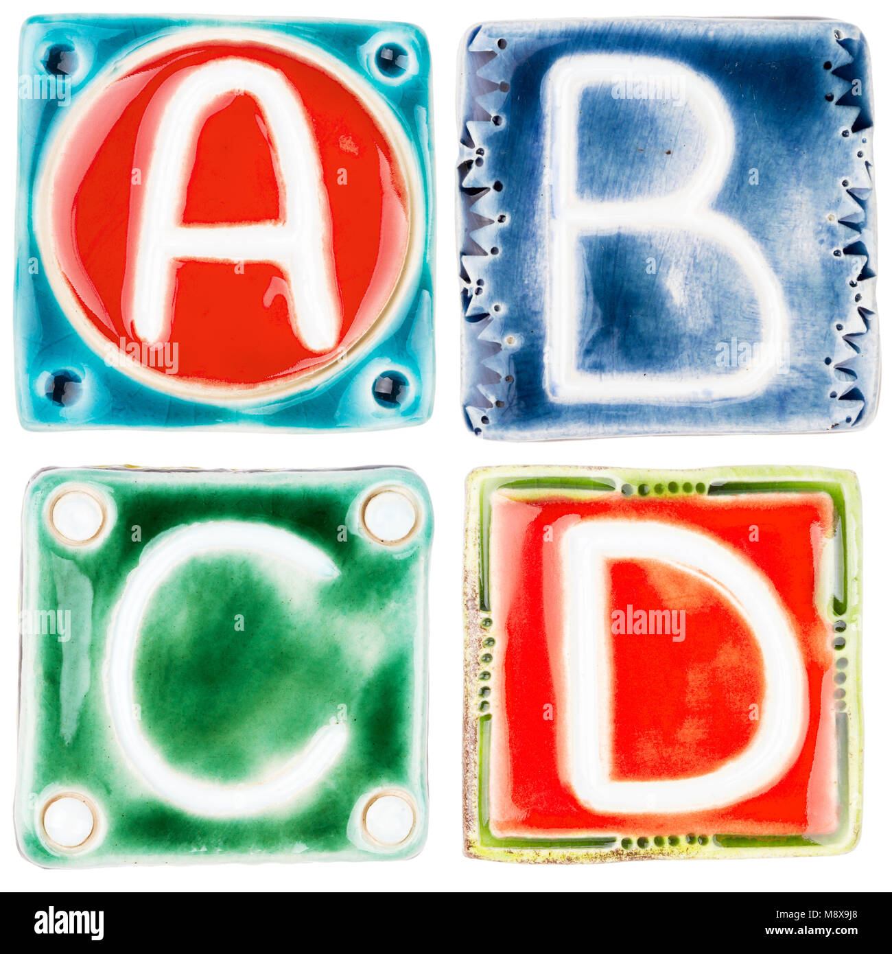 Colorful handmade ceramic letters isolated on white background Stock ...