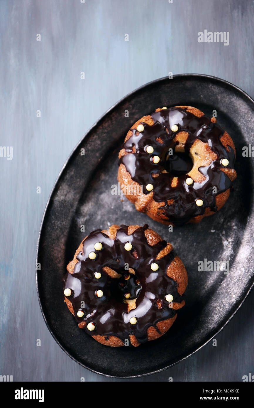 Chocolate cupcakes with chocolate icing, top view Stock Photo - Alamy
