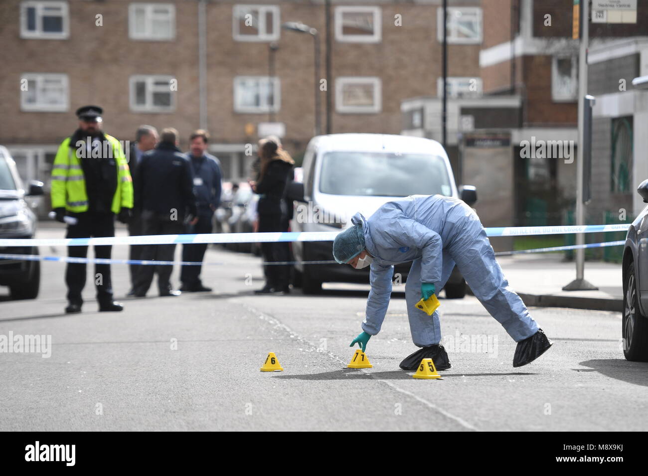 Evidence markers are placed next to cartridges in Mandeville Street ...