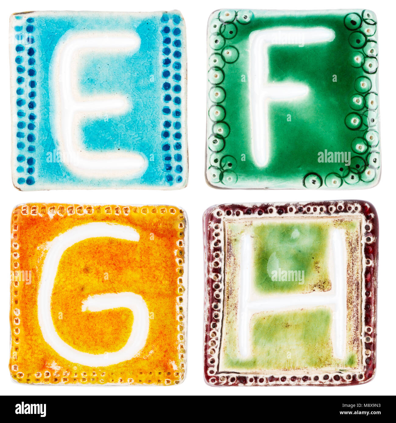 Colorful handmade ceramic letters isolated on white background Stock ...