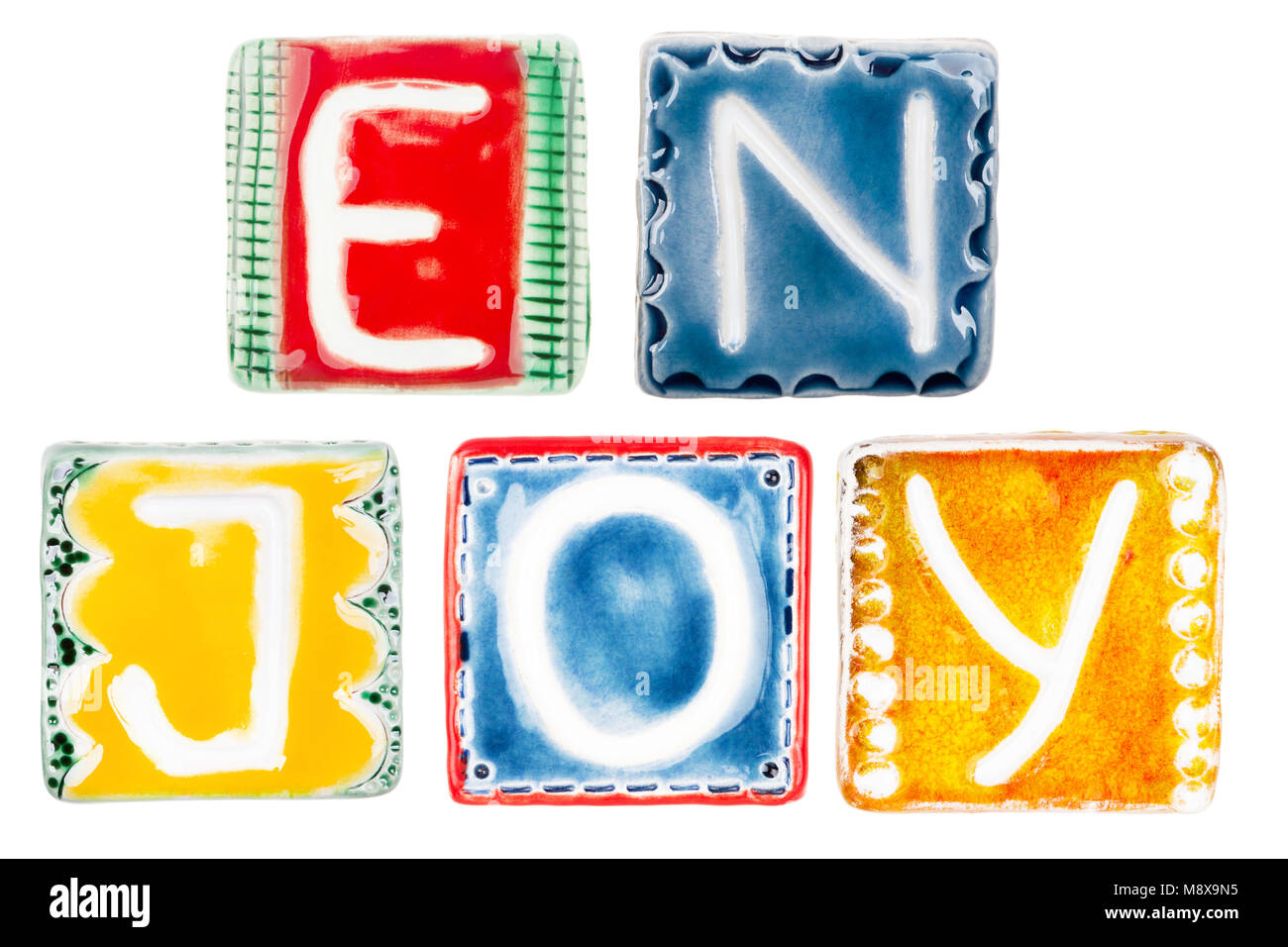 Word "ENJOY" made of handmade ceramic letters isolated on white Stock ...
