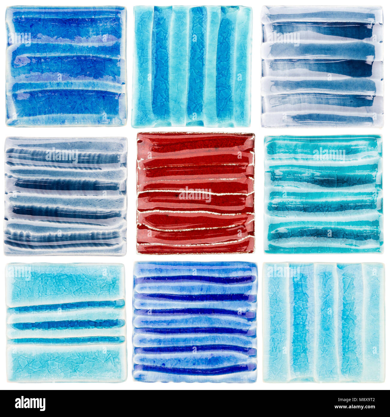 Collection of lined handmade glazed ceramic tiles isolated on white ...