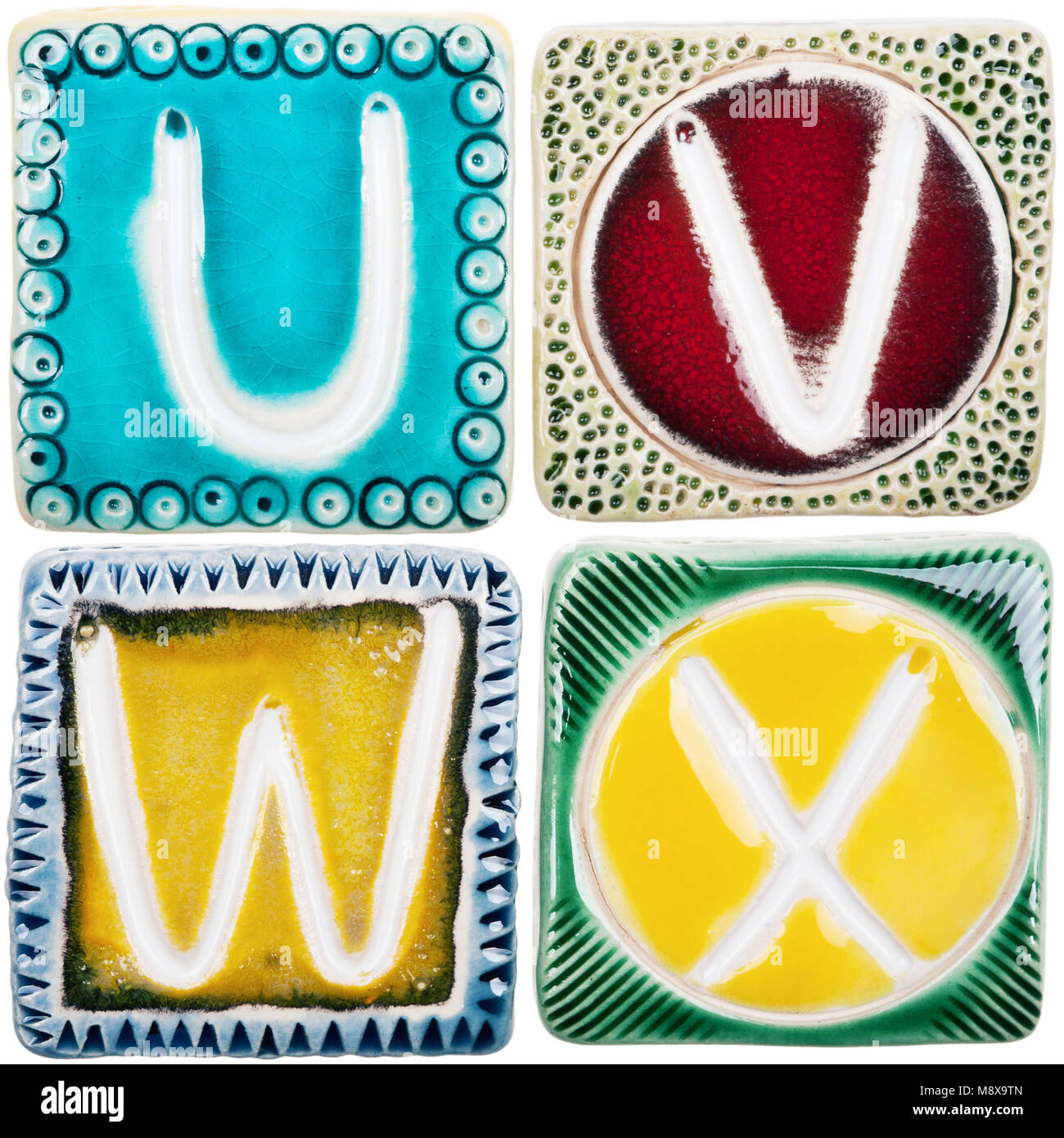 Colorful handmade ceramic letters isolated on white background Stock ...