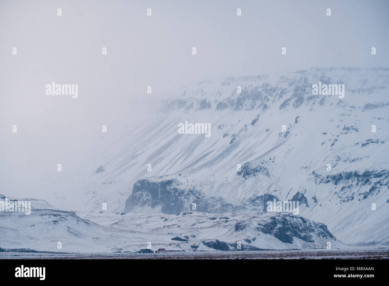 Dramatic icelandic landscape with snow covered mountains Stock Photo ...