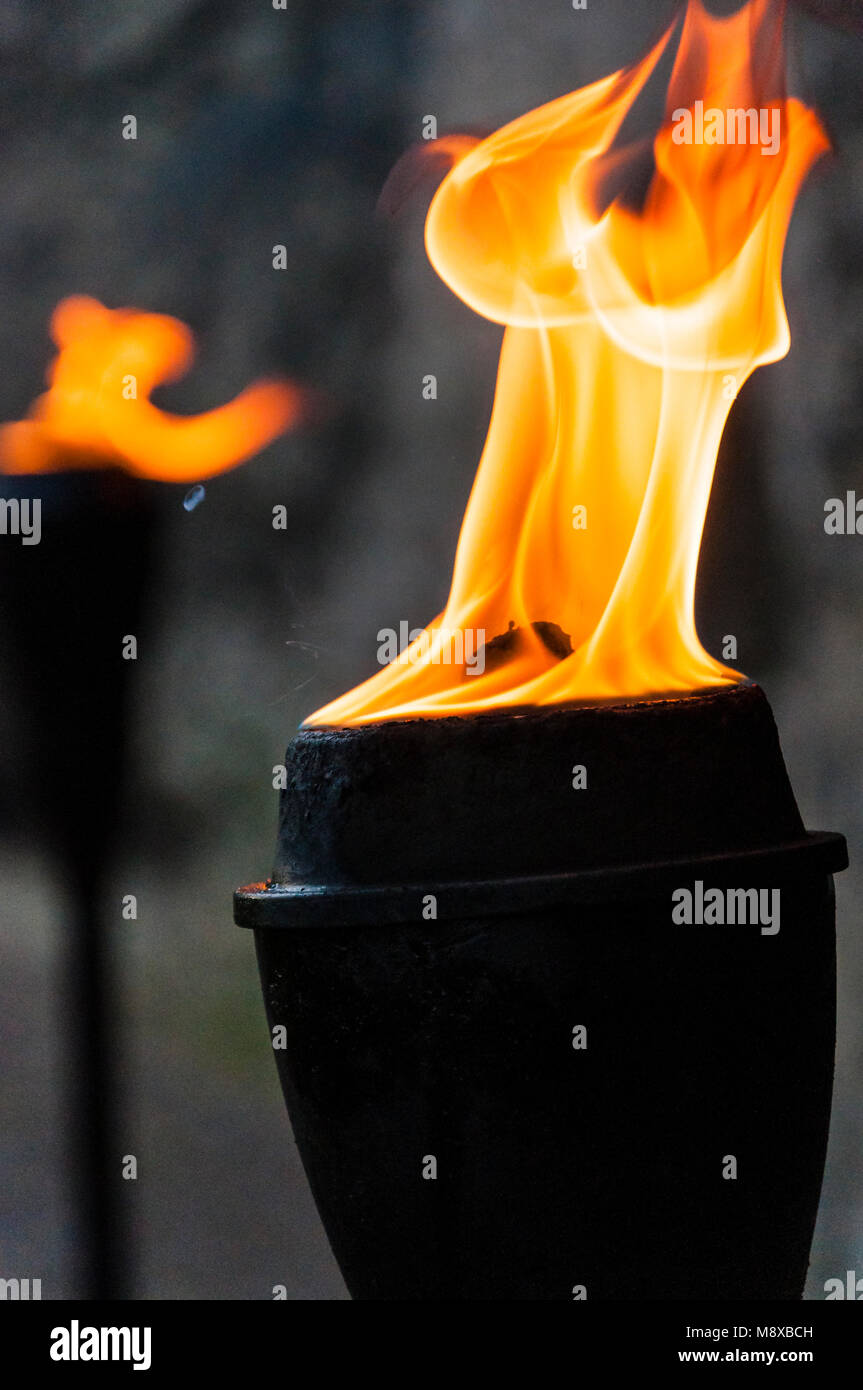 Oil flaming black metal torch. Medieval lighting equipment Stock Photo ...