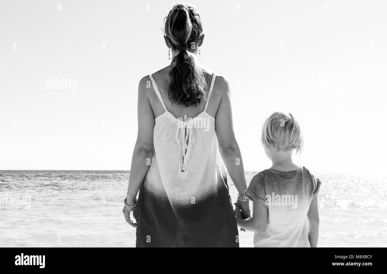 Mother and daughter child back view Black and White Stock Photos ...