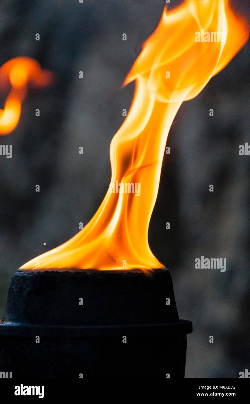 Oil flaming black metal torch. Medieval lighting equipment Stock Photo ...