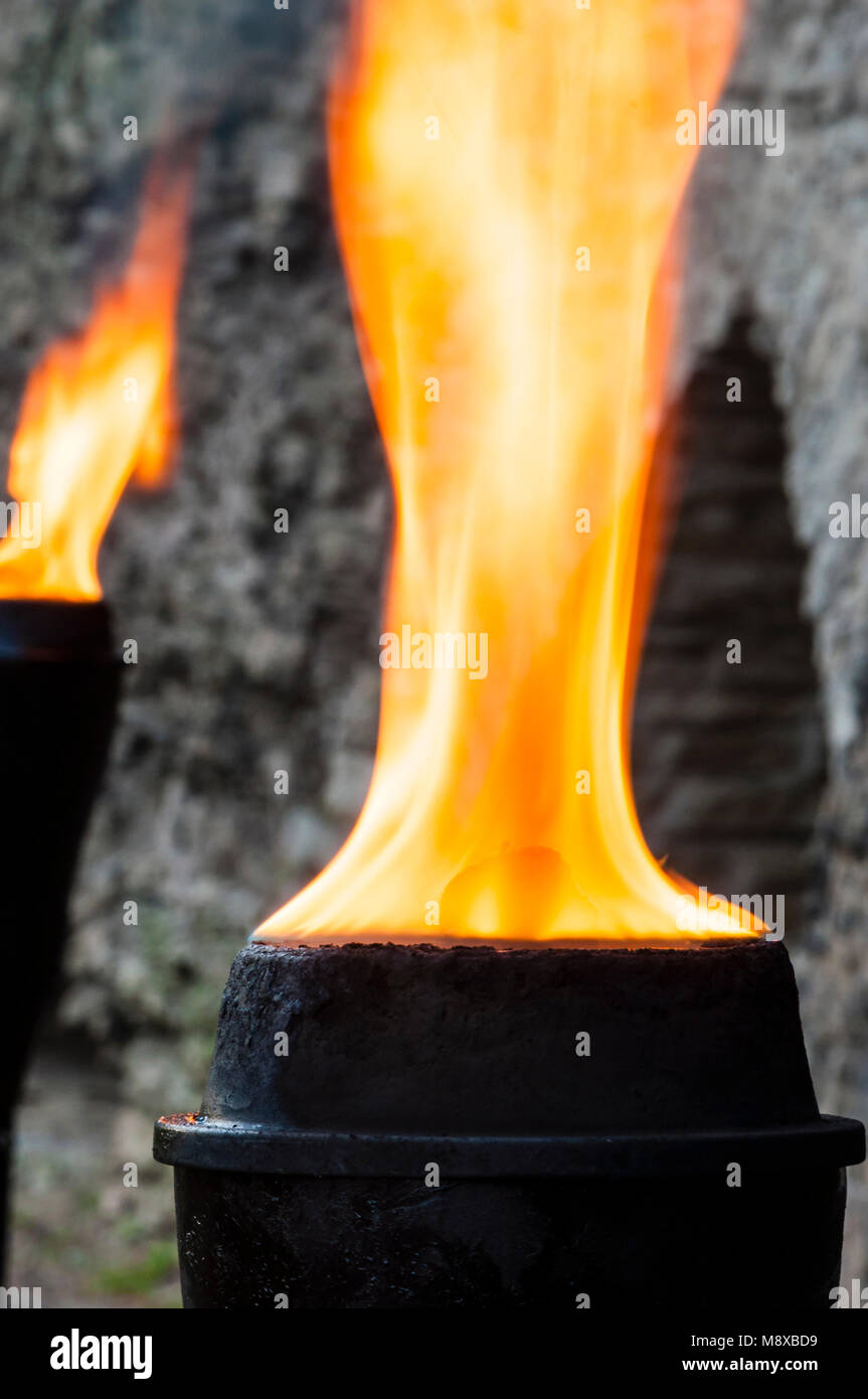 Oil flaming black metal torch. Medieval lighting equipment Stock Photo ...