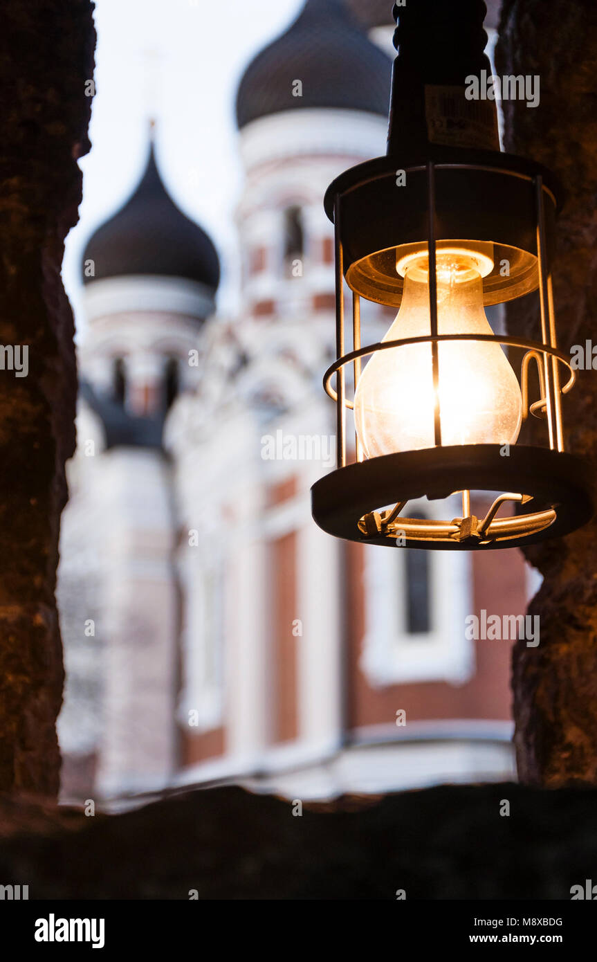 Hanging old traditional light bulb filament in a stone niche with ...