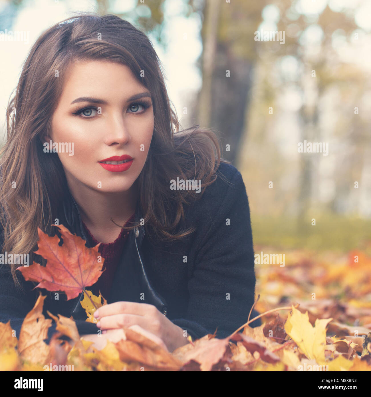 Autumn Woman Fashion Model with Fall Leaves Outdoors. Autumn Beauty ...