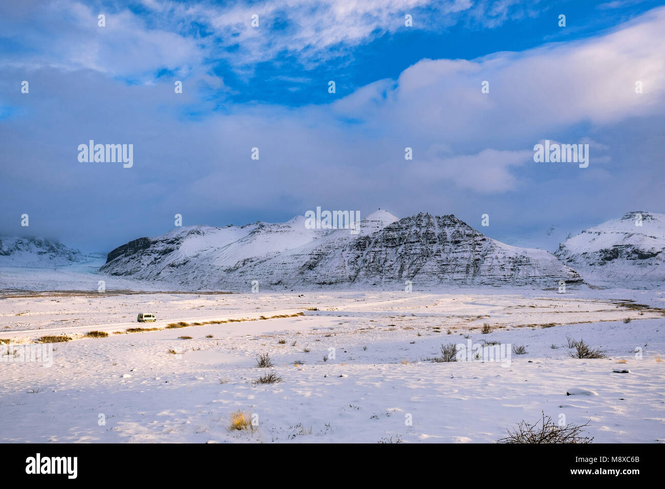 Dramatic icelandic landscape with snow covered mountains Stock Photo ...