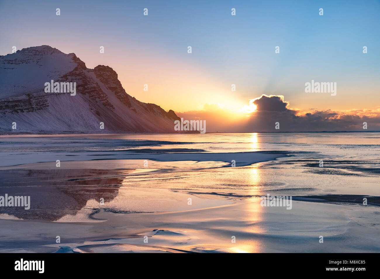 Sun rays peeking through clouds hi-res stock photography and images - Alamy