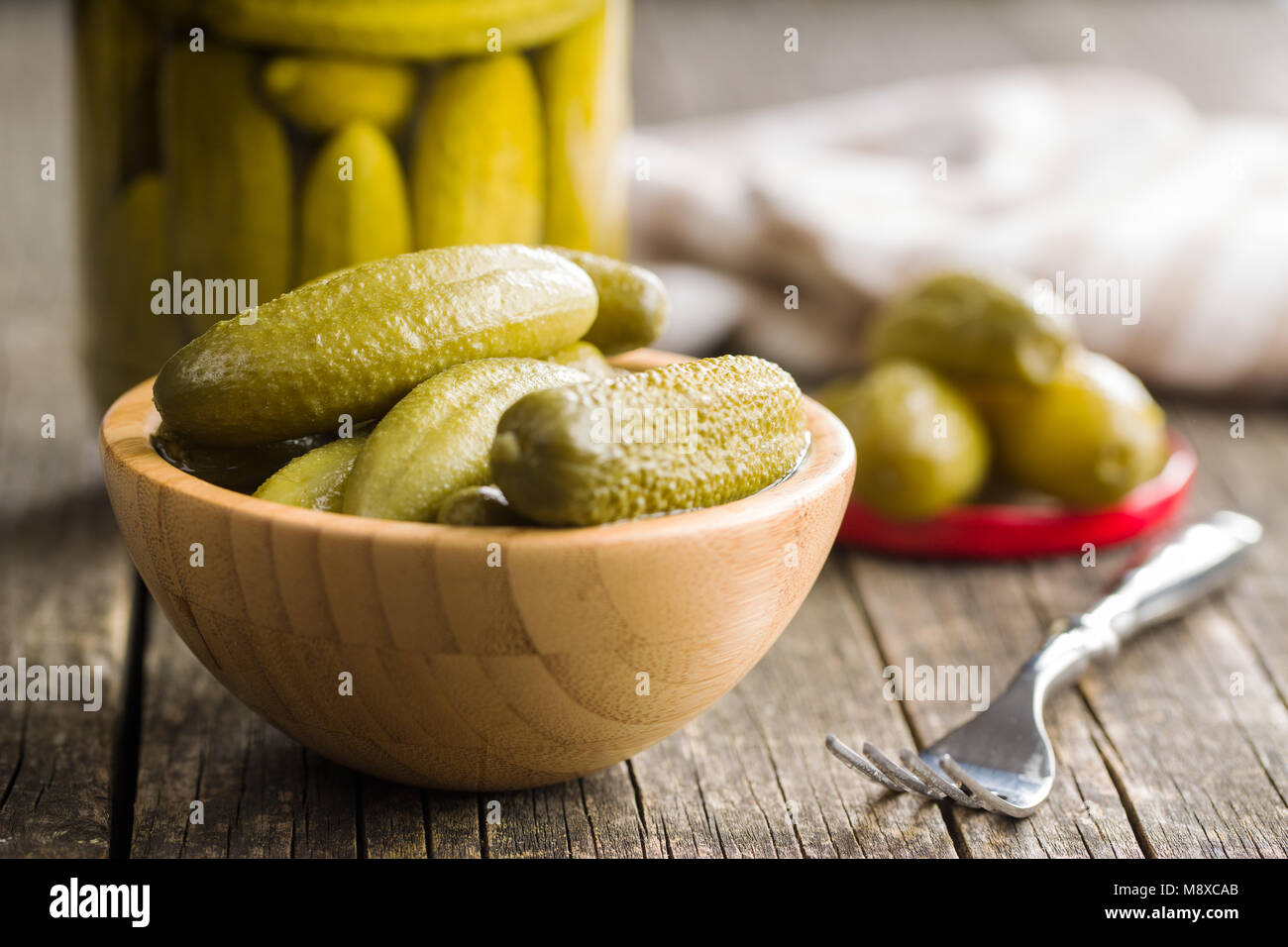 Pickles in bowl. Tasty preserved cucumbers Stock Photo - Alamy