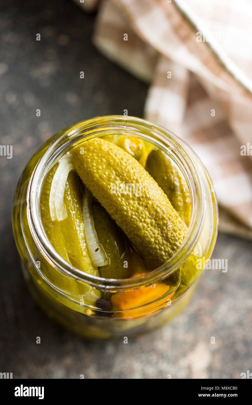 Pickles in bowl. Tasty preserved cucumbers in jar Stock Photo - Alamy