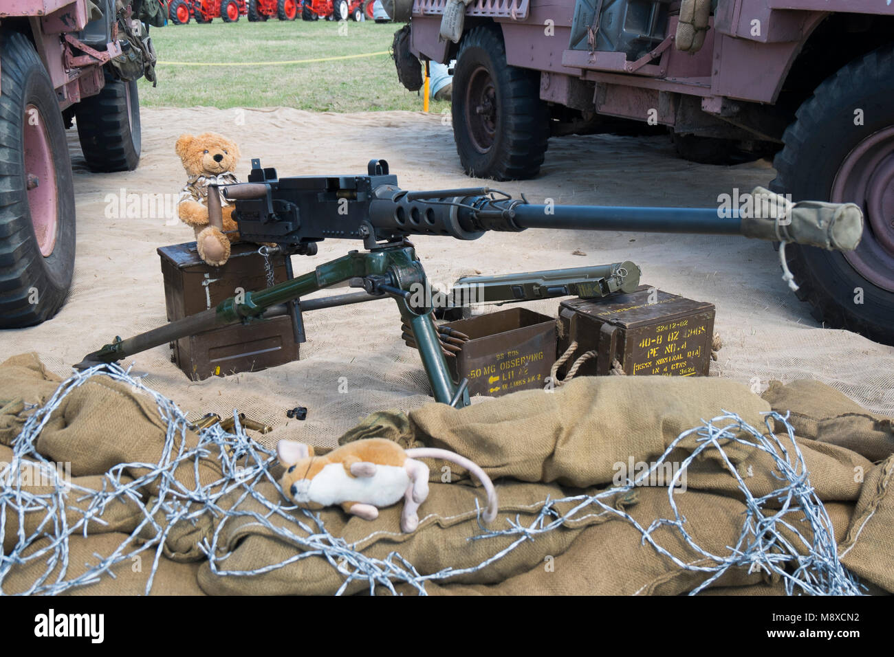A teddy bear posed with a machine gun behind sandbags as part of the ...