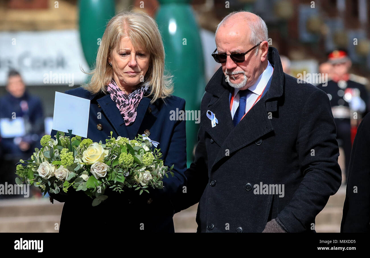 Wendy Parry and her husband Colin (right) lay flowers at the memorial ...