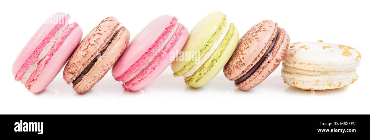 Different types of french sweet delicacy, macaroons in row. Isolated on ...