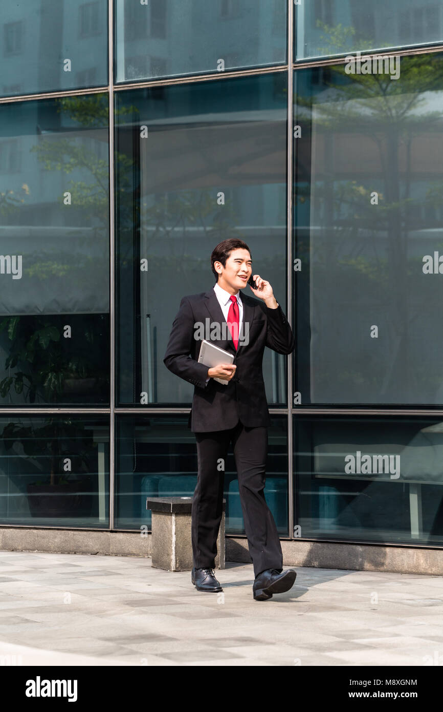 Asian man talking phone hi-res stock photography and images - Alamy
