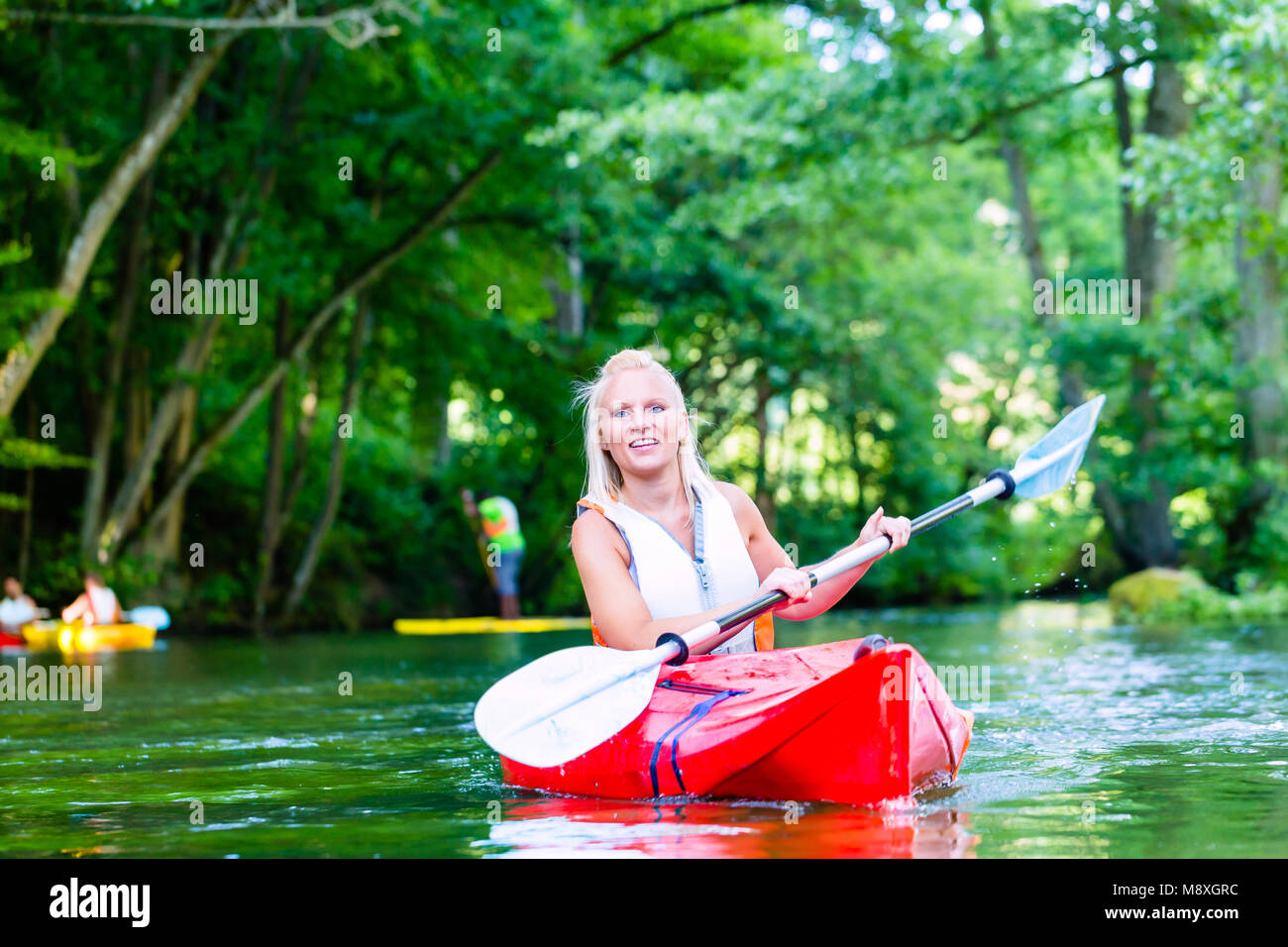 Woman canoe hi-res stock photography and images - Alamy