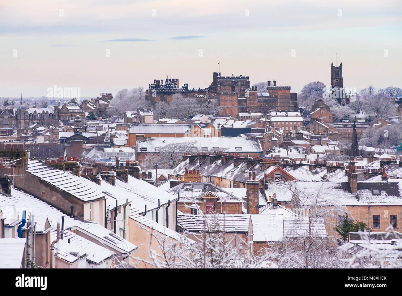Snowy view over Lancaster, England, from the east with Lancaster Castle ...