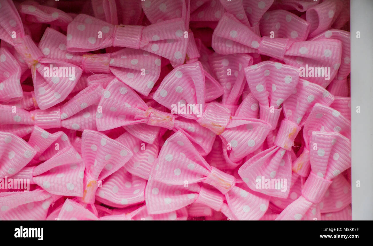 Collection of pink color bows with dots in view Stock Photo - Alamy
