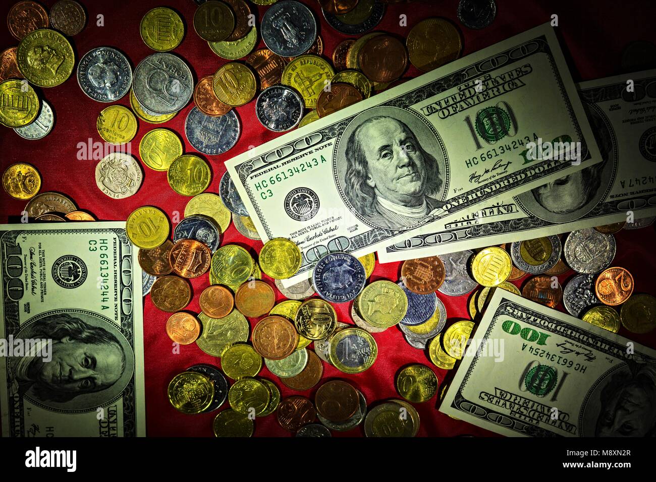 Money of the different countries on red background Stock Photo - Alamy
