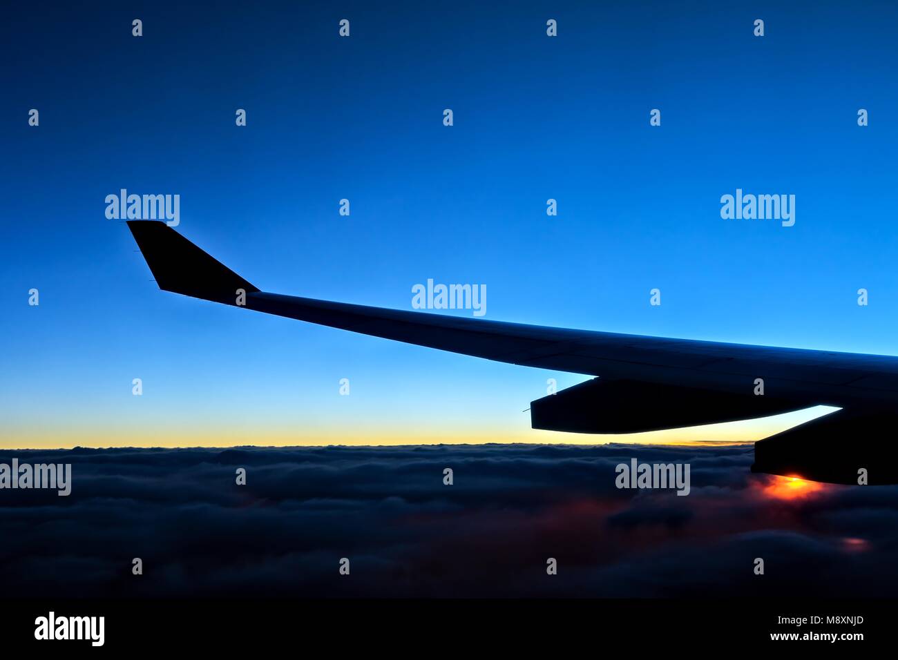 Nice sunrise view from airplane Stock Photo - Alamy