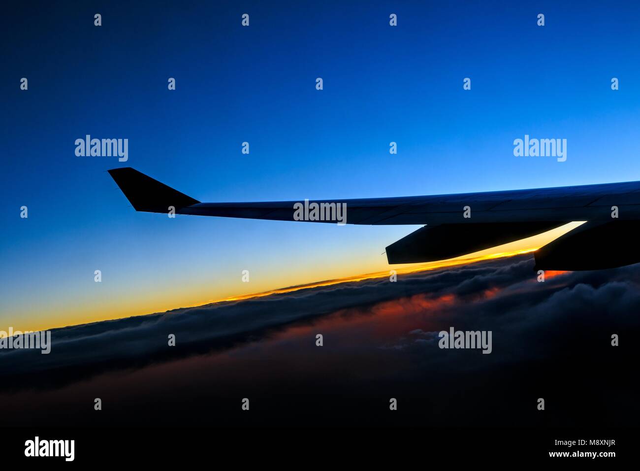 Nice sunrise view from airplane Stock Photo - Alamy