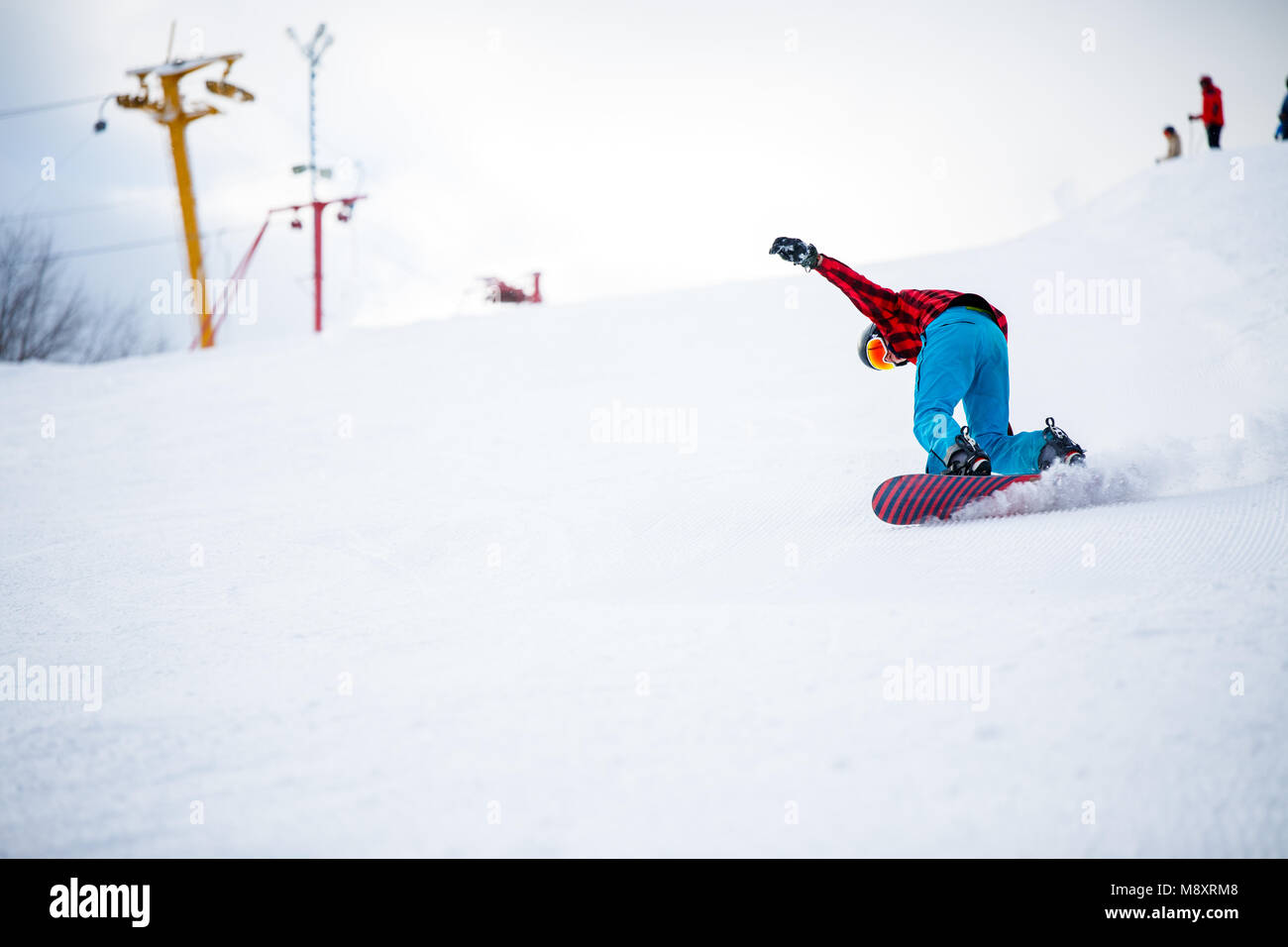 Picture of athlete with snowboard jumping on snowy hill Stock Photo - Alamy