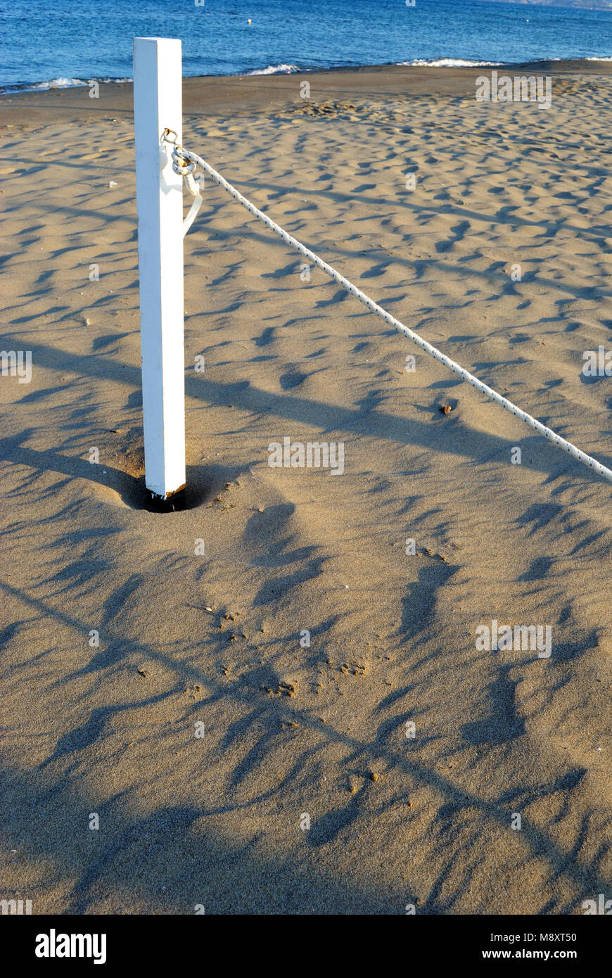 summer sea, white bollard on the beach Stock Photo - Alamy