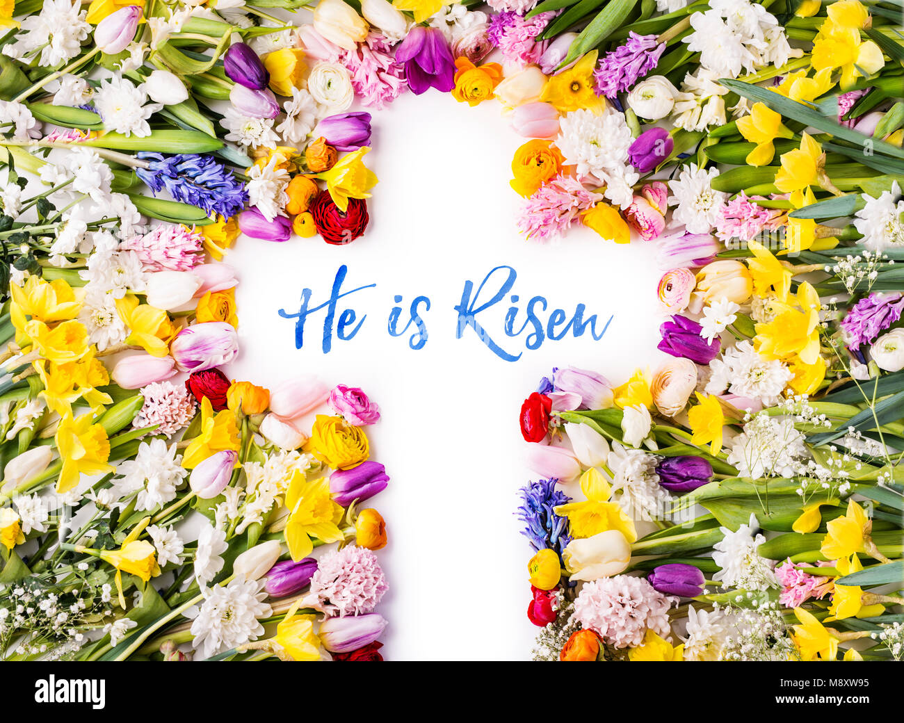 A cross on a colorful flower background. Easter flat lay Stock Photo ...