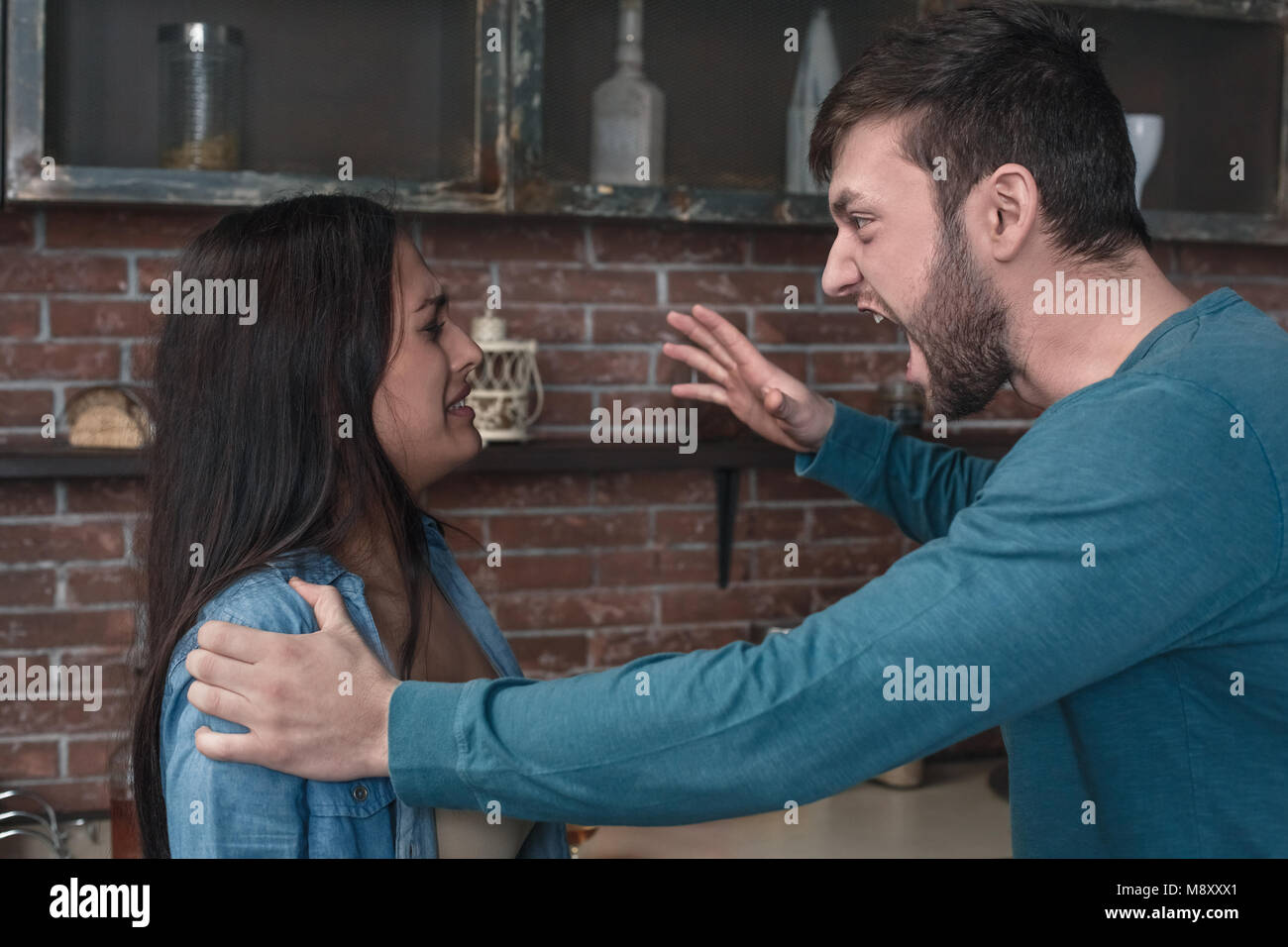 Young family man and woman domestic violence problems concept husband ...