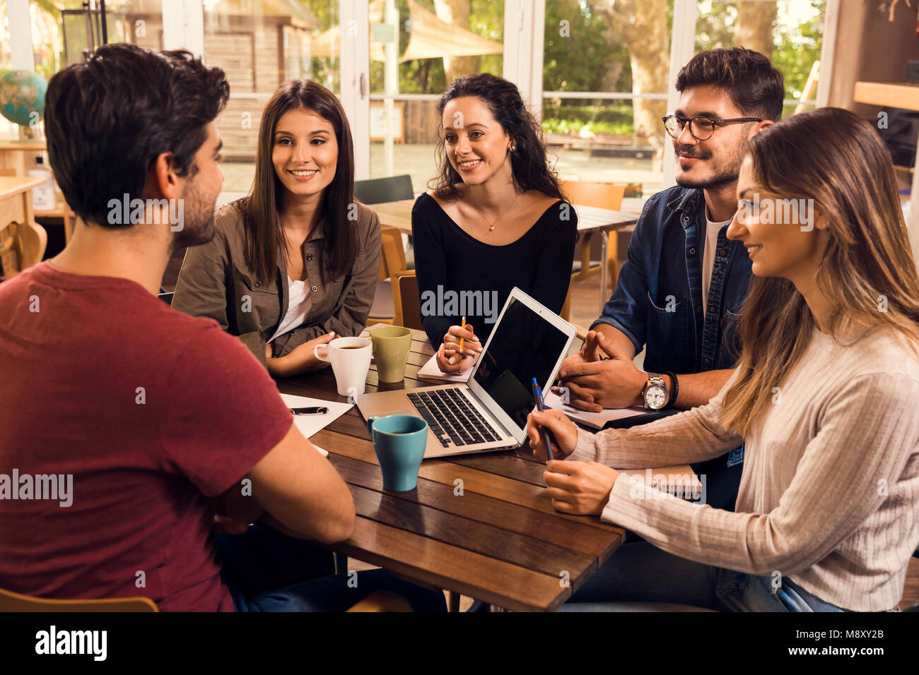 Group of friends studying together for finals Stock Photo - Alamy
